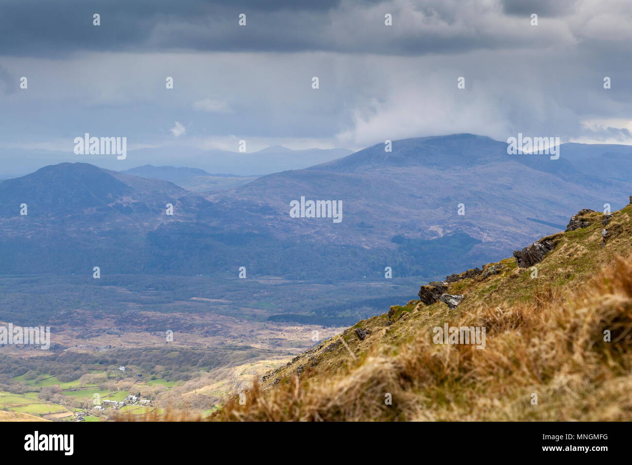 Rain clouds pass over the summit of Moel Hebog as viewed from the ...