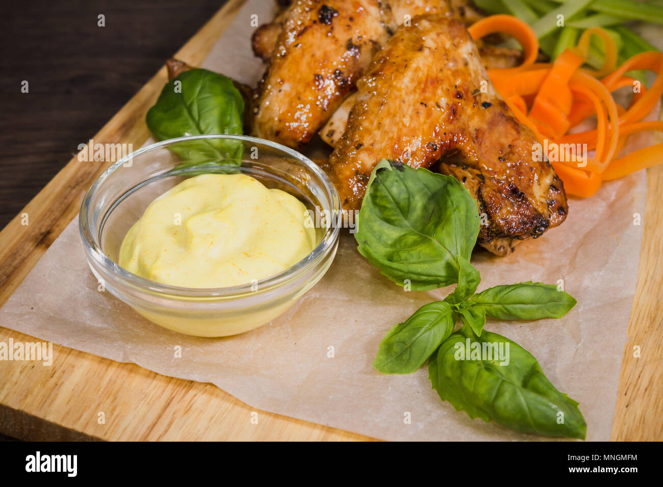 Fried chicken wings with sauce and salad Stock Photo - Alamy