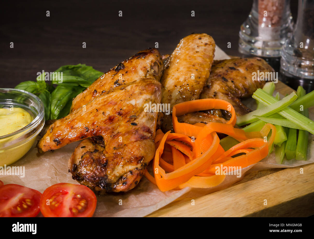 Fried chicken wings with sauce and salad Stock Photo - Alamy