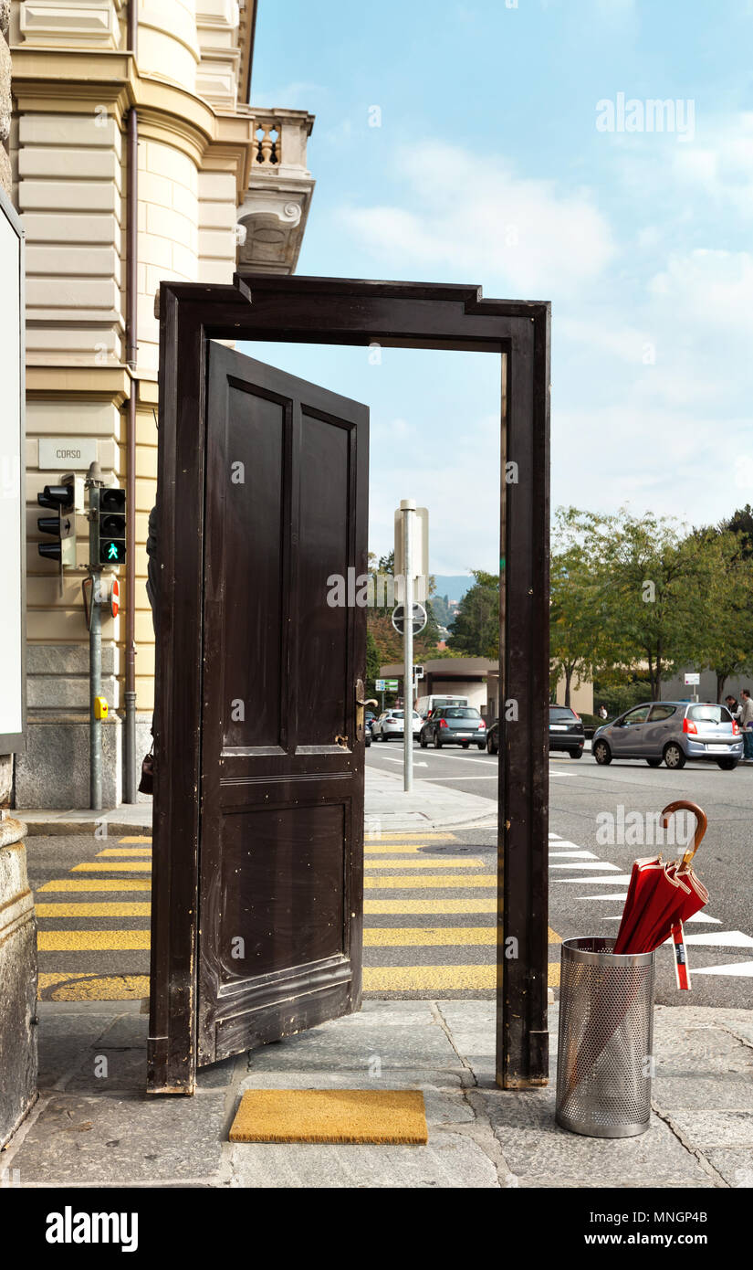 old door opened in the city, surreal scene Stock Photo - Alamy