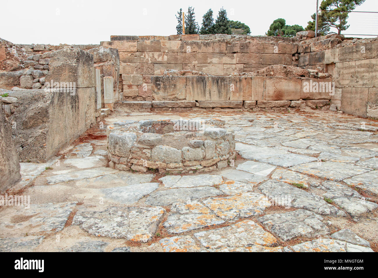 Ancient courtyard with waterwell in Phaistos Stock Photo - Alamy