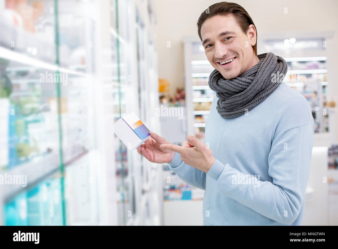 Charming merry man relieving cold symptoms Stock Photo - Alamy