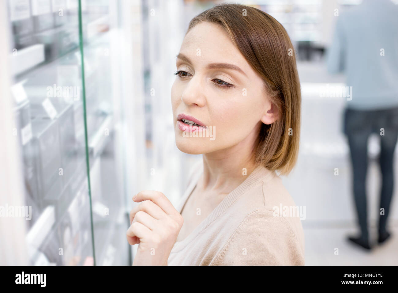 Happy merry woman visiting store Stock Photo - Alamy