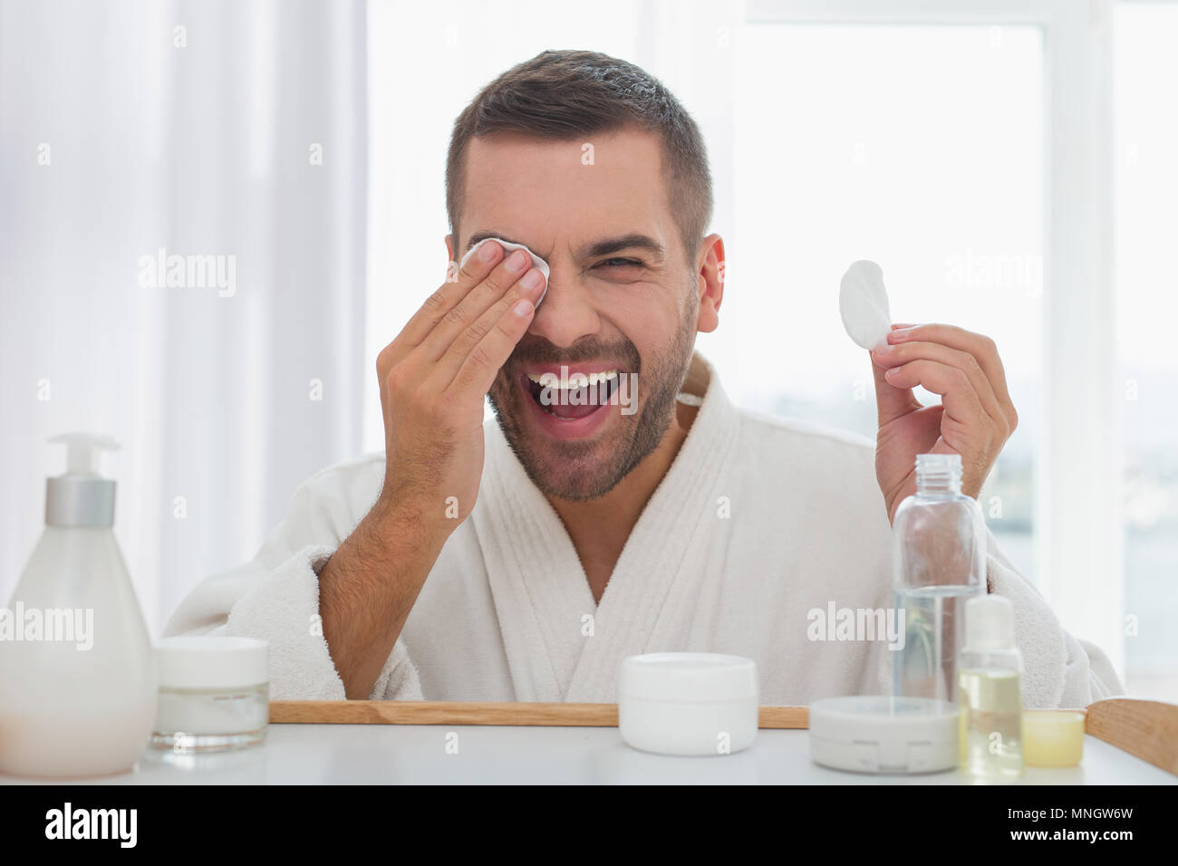 Man using lotion hi-res stock photography and images - Alamy