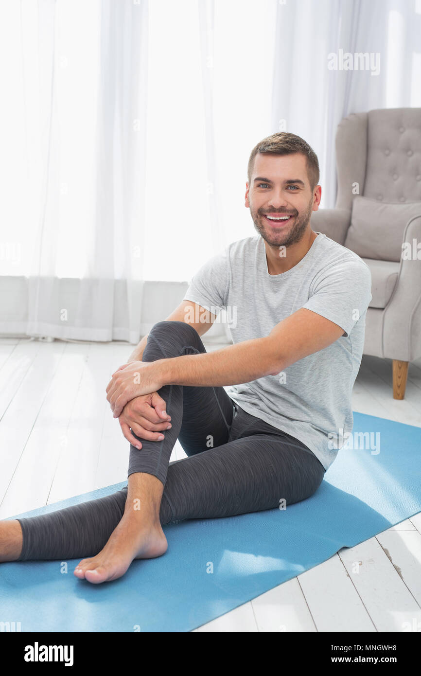 Positive delighted man stretching hi-res stock photography and images ...
