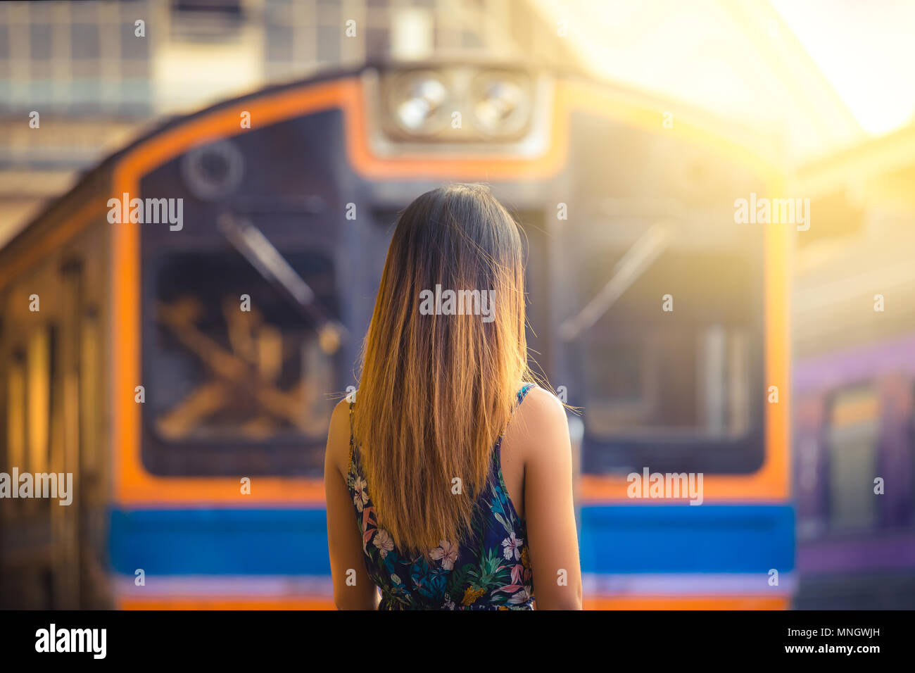 Woman waiting for the train hi-res stock photography and images - Alamy