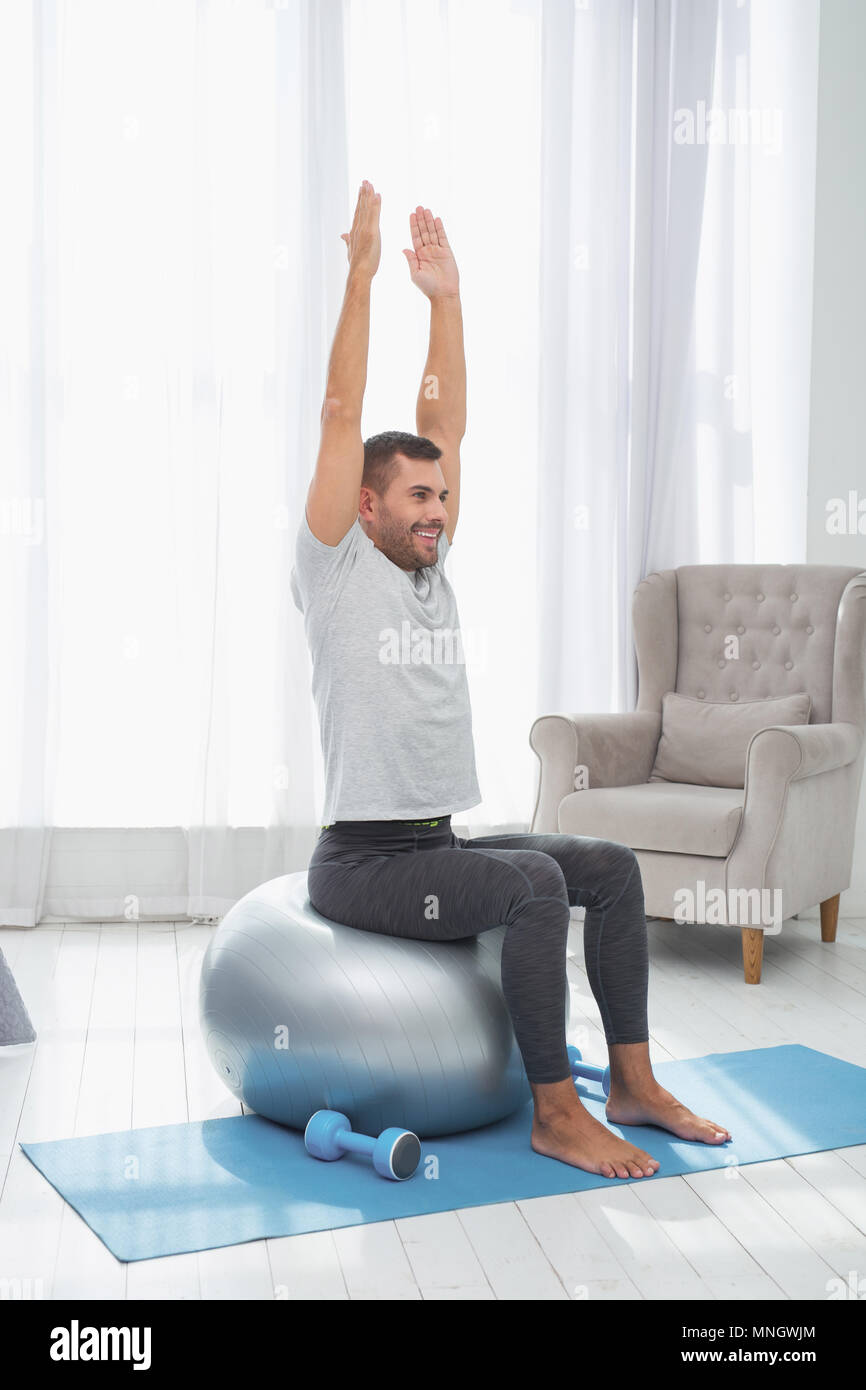 Positive happy man holding his hands up Stock Photo - Alamy