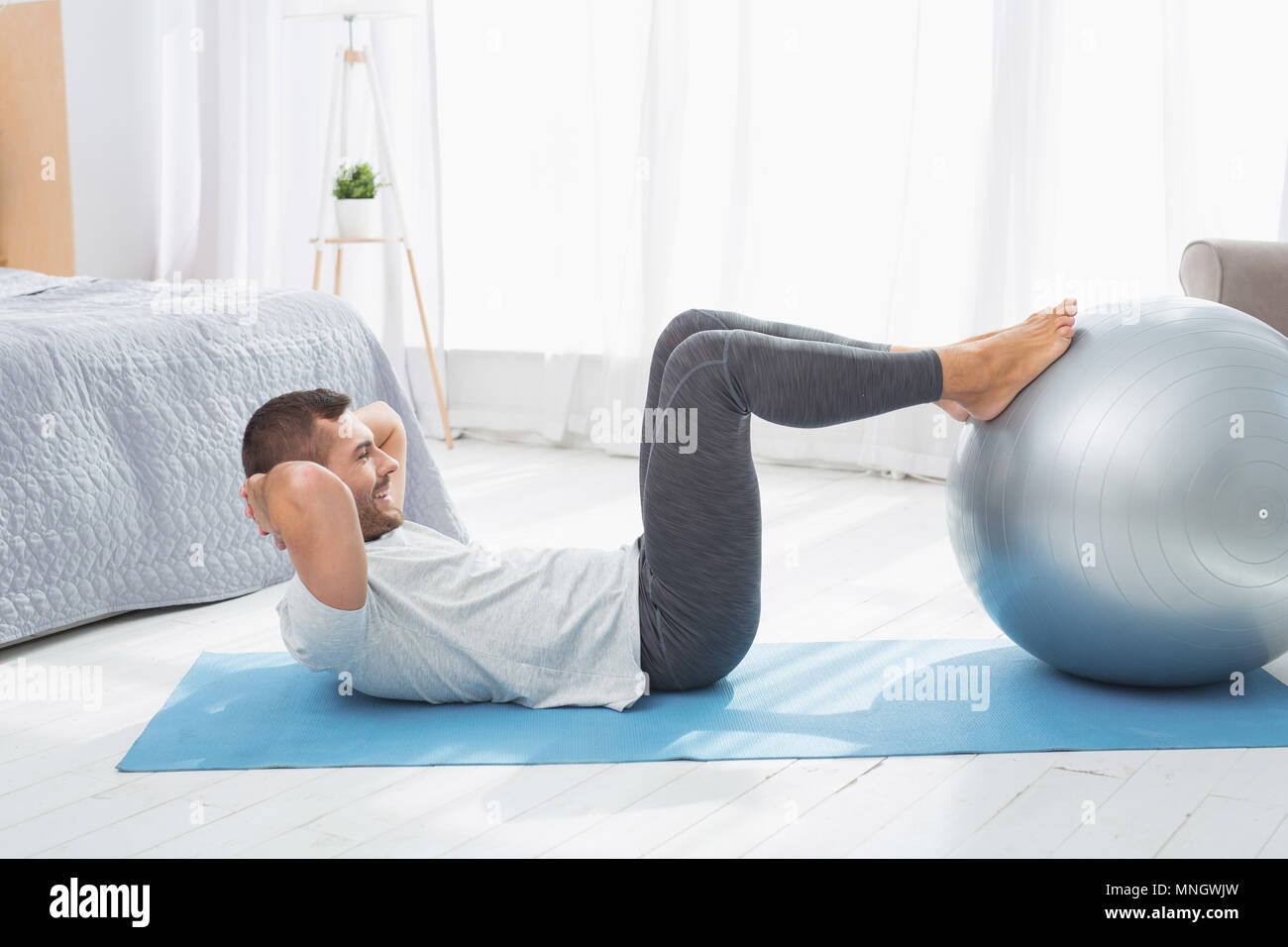 Positive healthy man exercising Stock Photo - Alamy