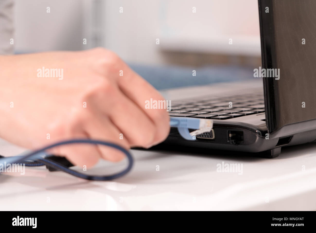 Plugging lan cable port hand hi-res stock photography and images - Alamy