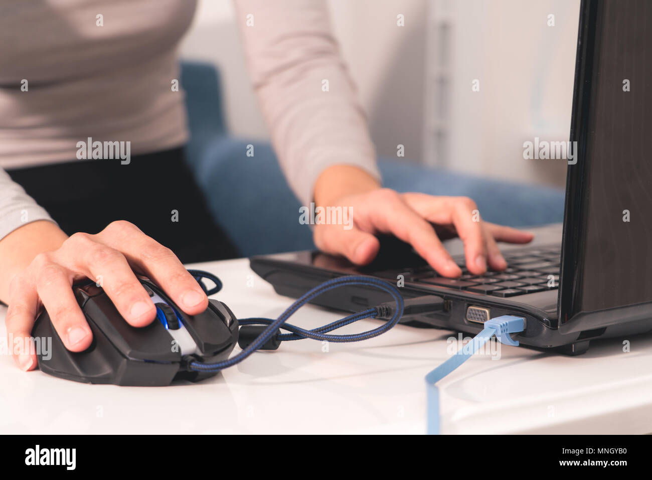 Hand using mouse connected hi-res stock photography and images - Alamy