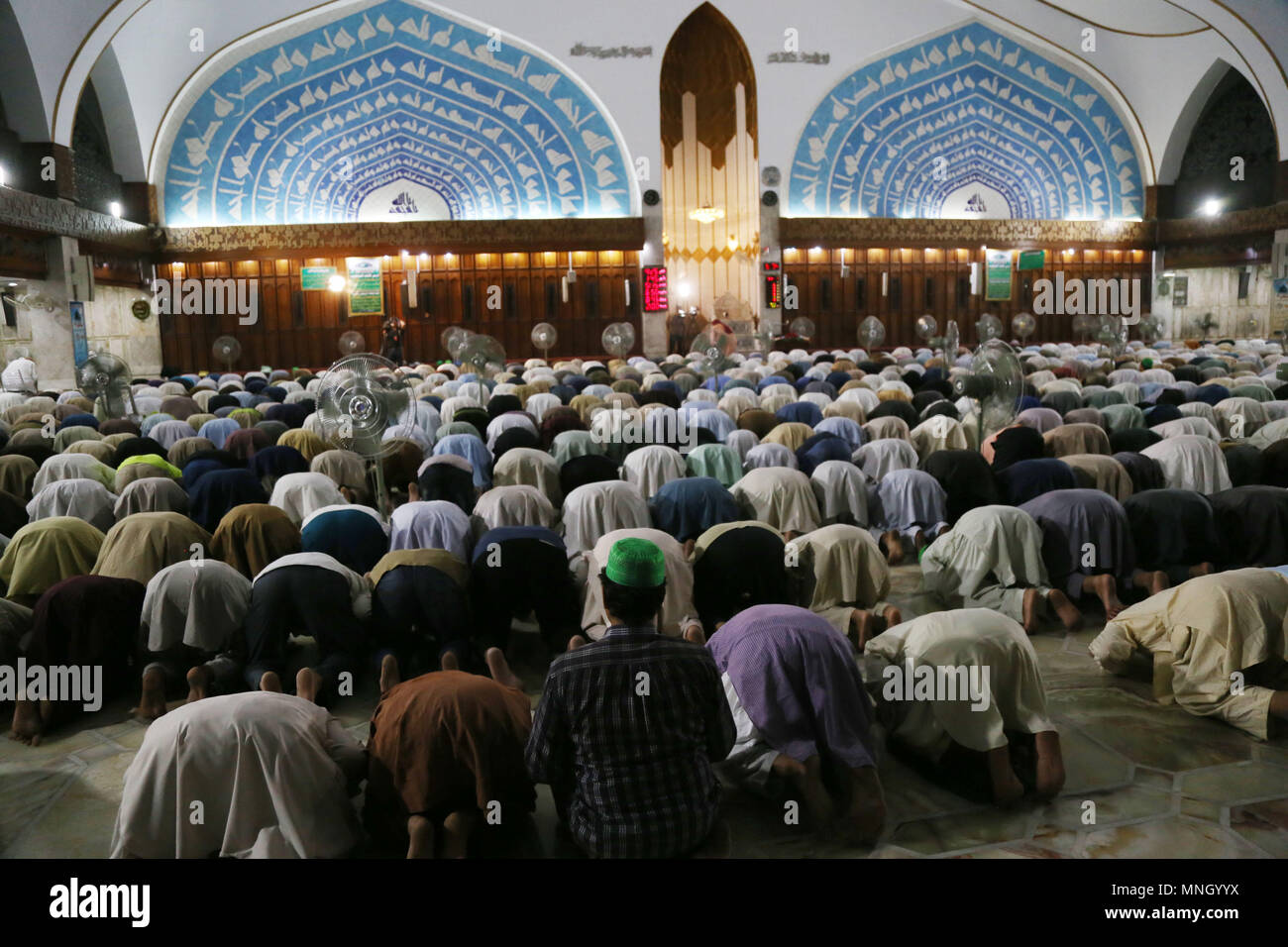 Pakistani faithful Muslims offering first an evening prayer called ...