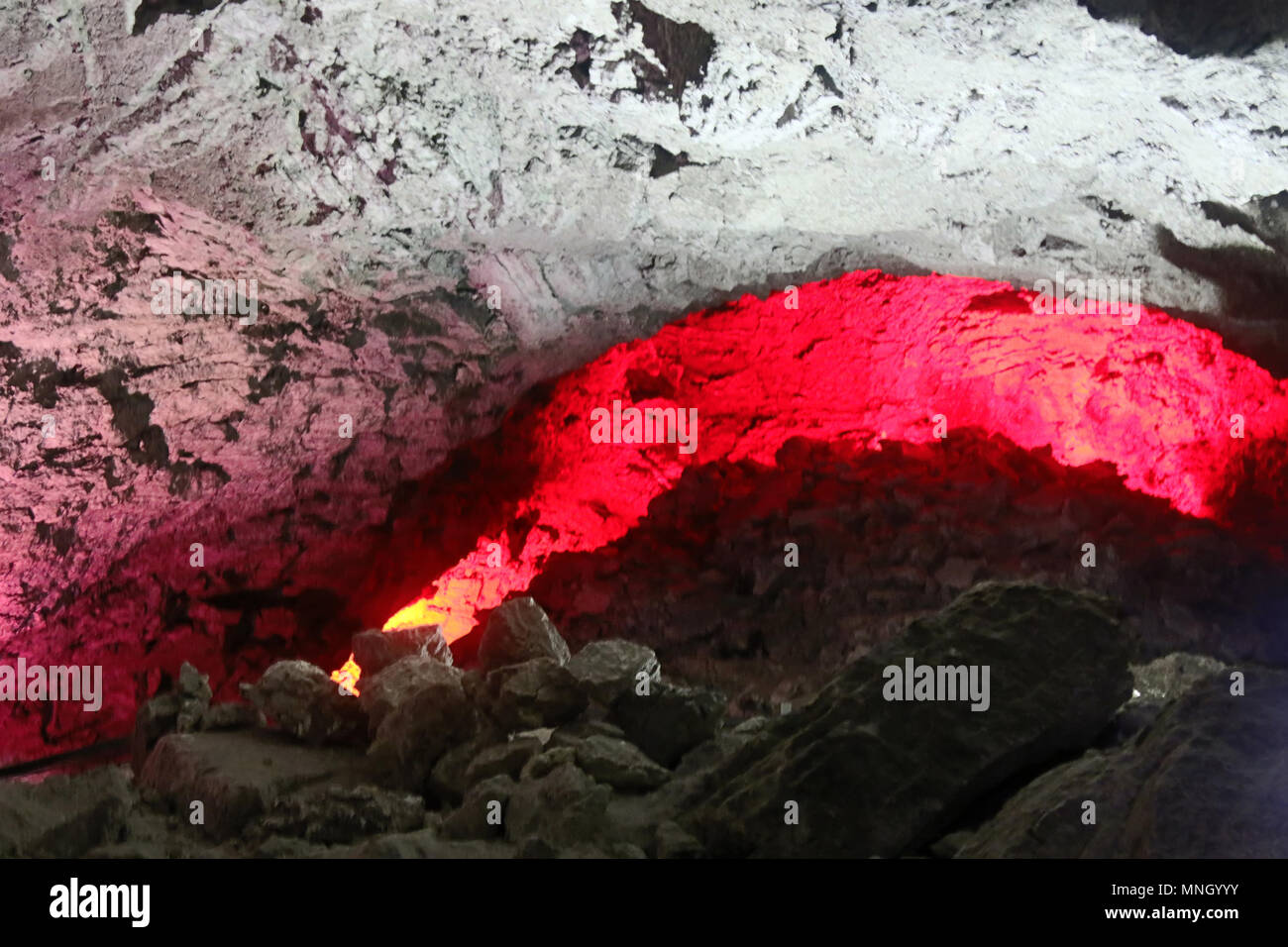 Karst cave in variety of colored light. Cave in carbonate rocks Stock ...
