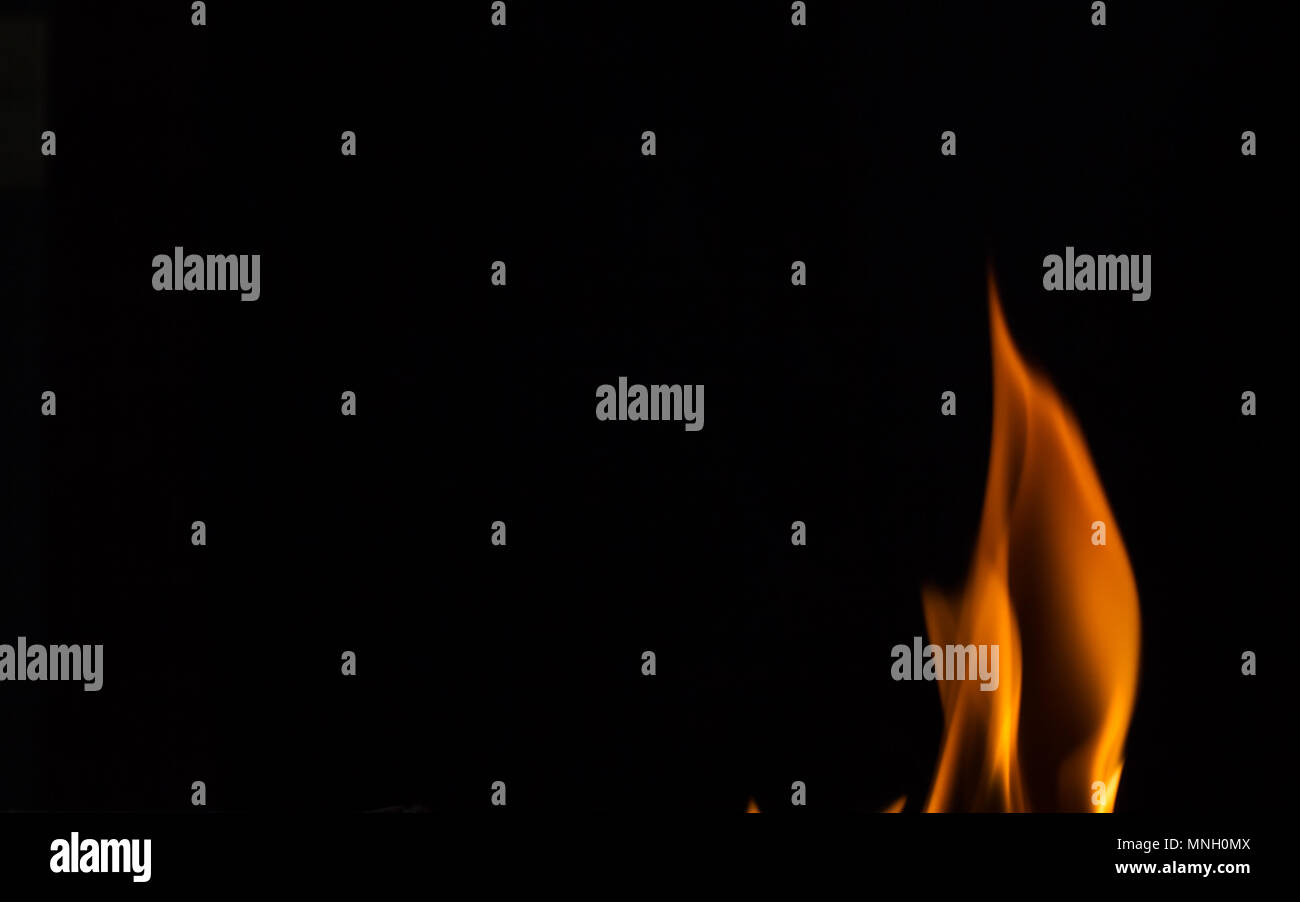 Beautiful yellow fire flames on black Stock Photo - Alamy