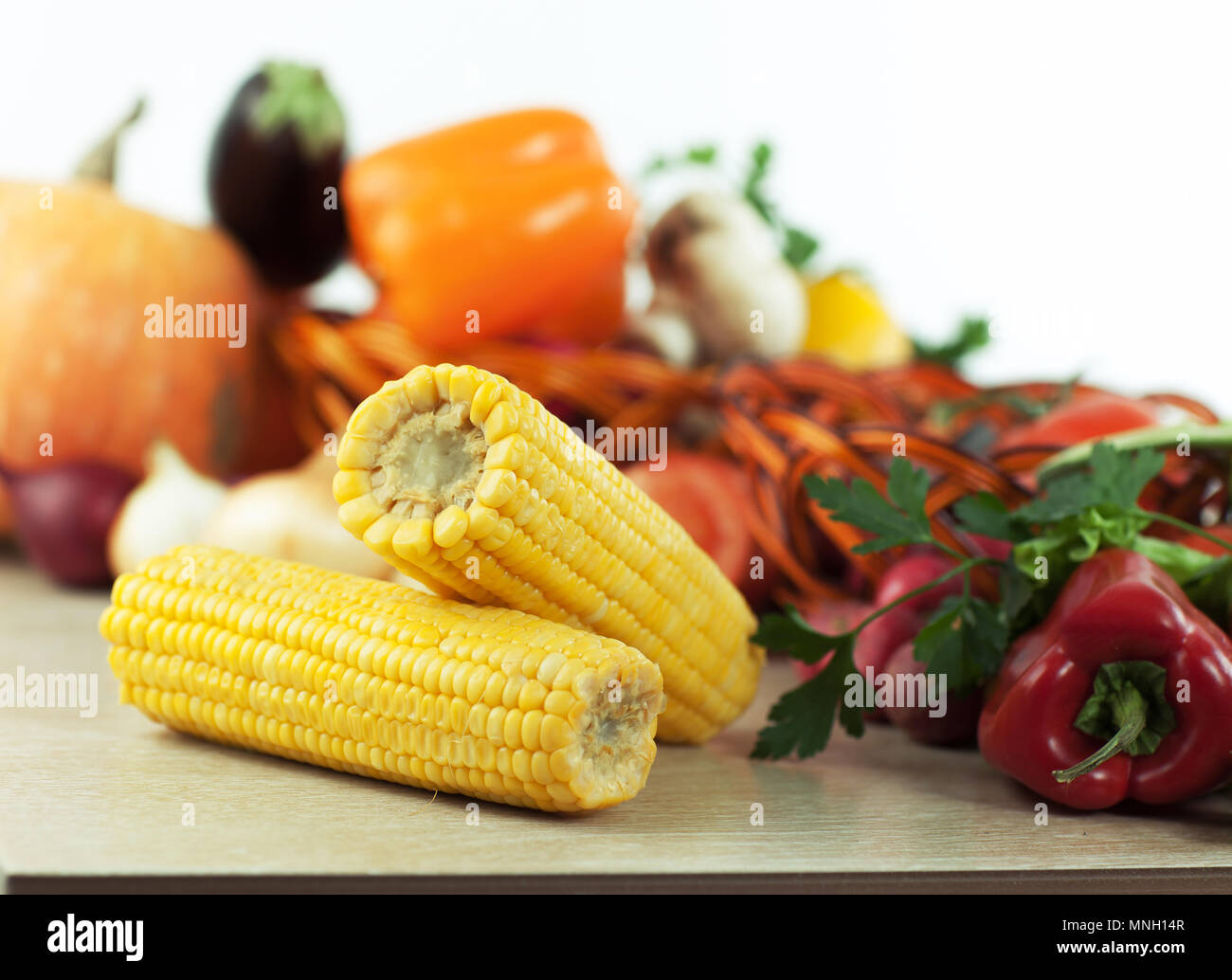 corn on the background of fresh vegetables Stock Photo - Alamy