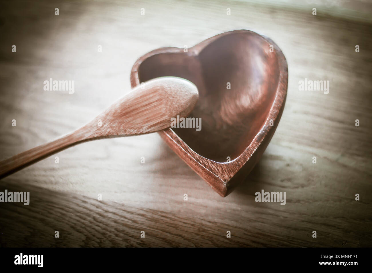closeup. empty wooden salad bowl and wooden paddle Stock Photo - Alamy