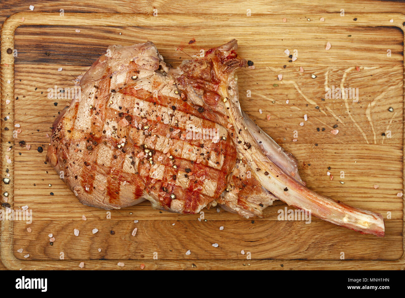 Close up one grilled roasted Tomahawk ribeye beef steak with rib bone ...