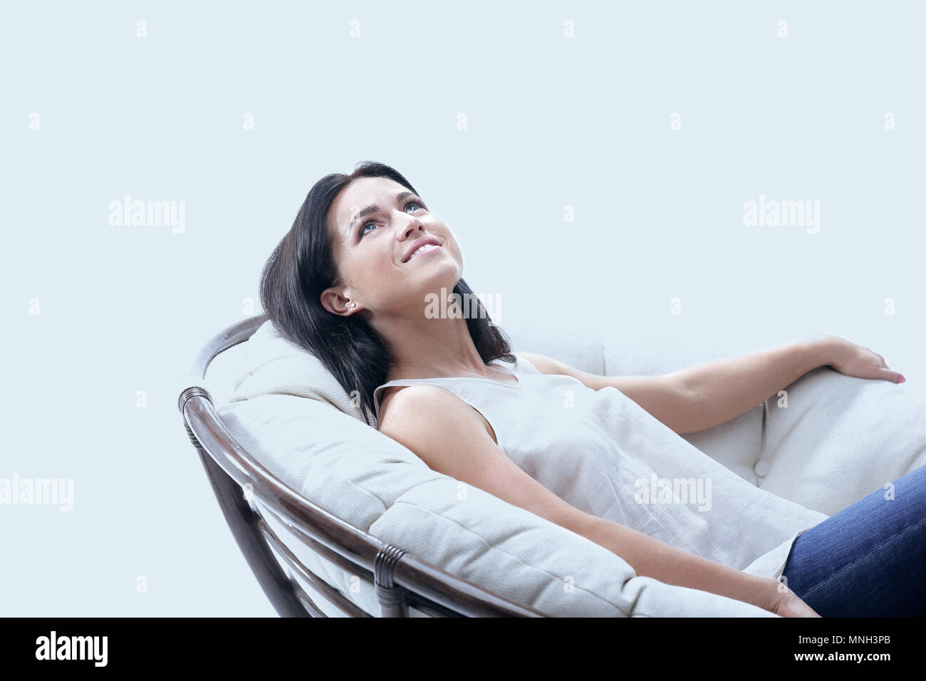 beautiful young woman relaxing in a round cozy soft chair Stock Photo ...