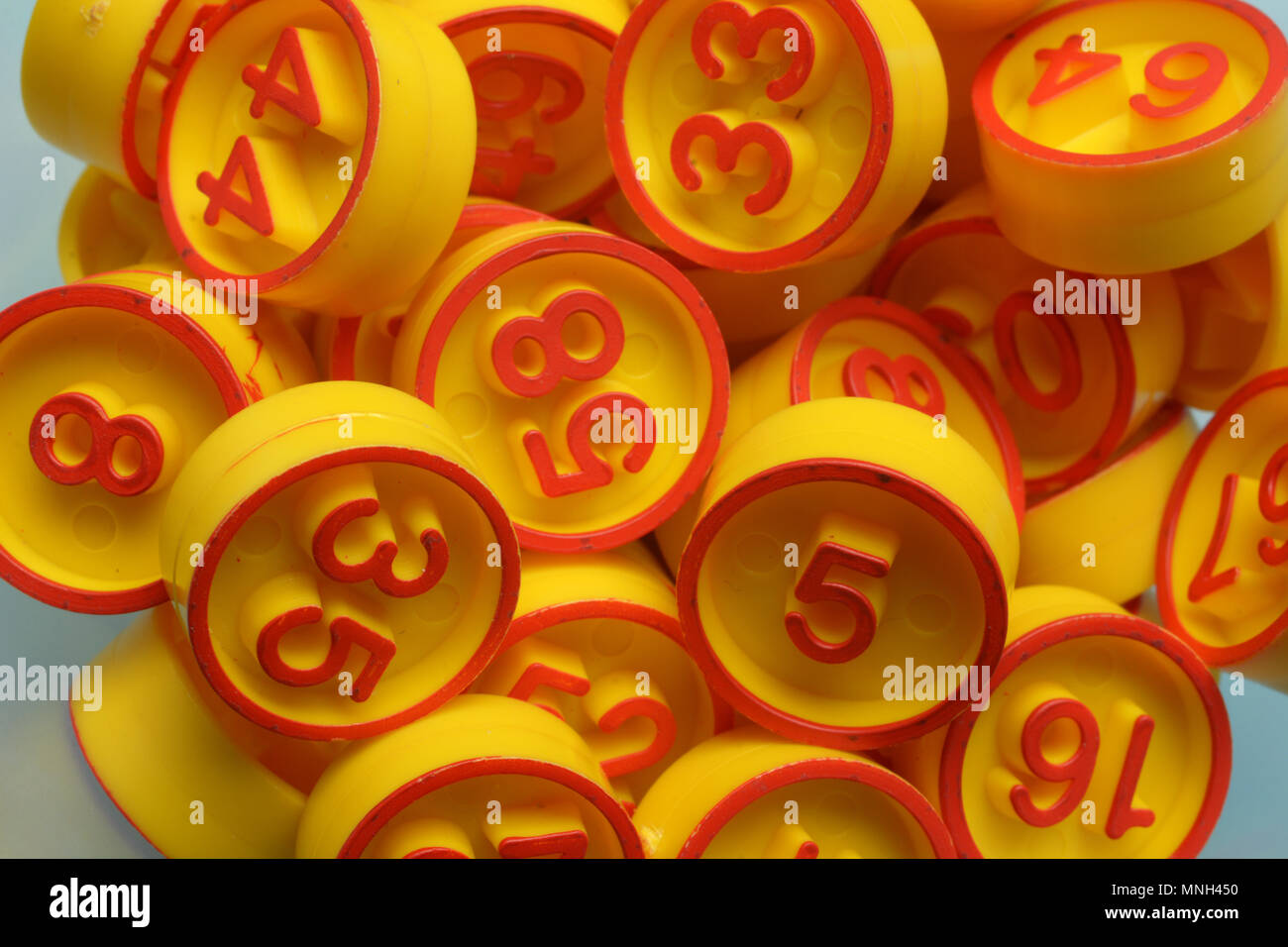 pile of bingo numbers in the foreground - yellow and red Stock Photo ...