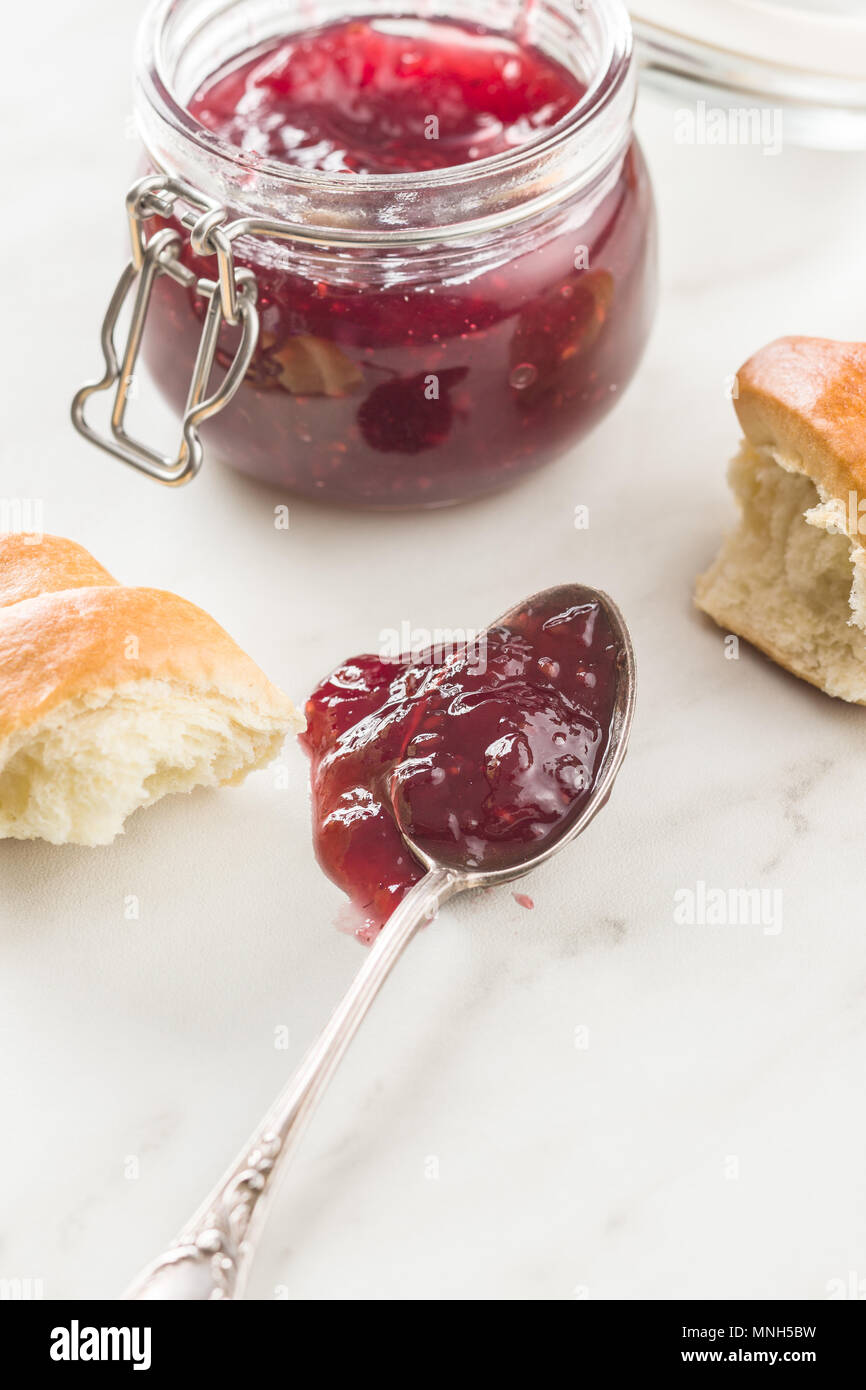 Tasty raspberry jam jelly in spoon Stock Photo - Alamy