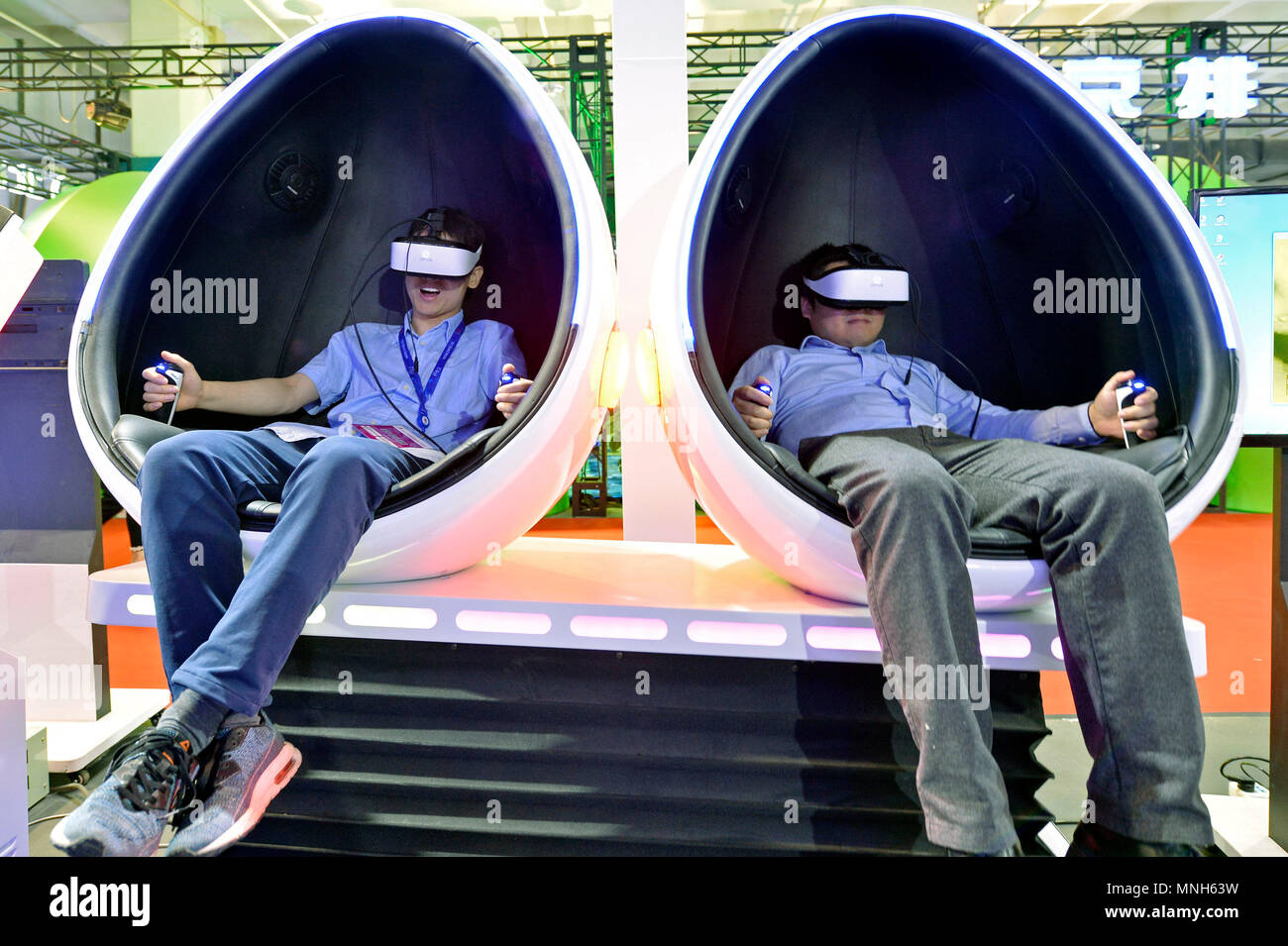 Beijing, China. 17th May, 2018. People experience a technology ...