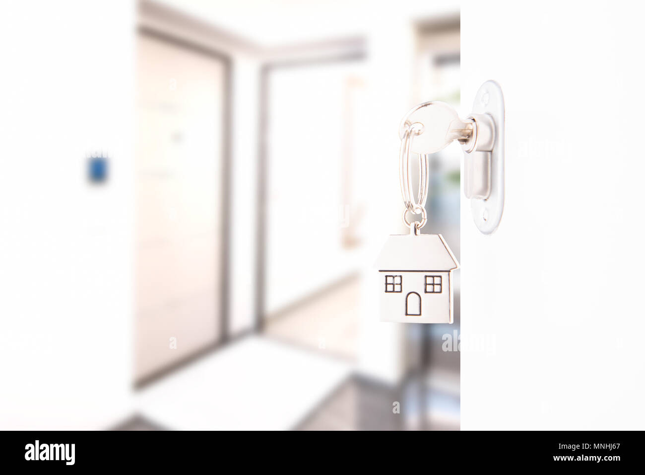 House key in the door with inside wiew Stock Photo - Alamy