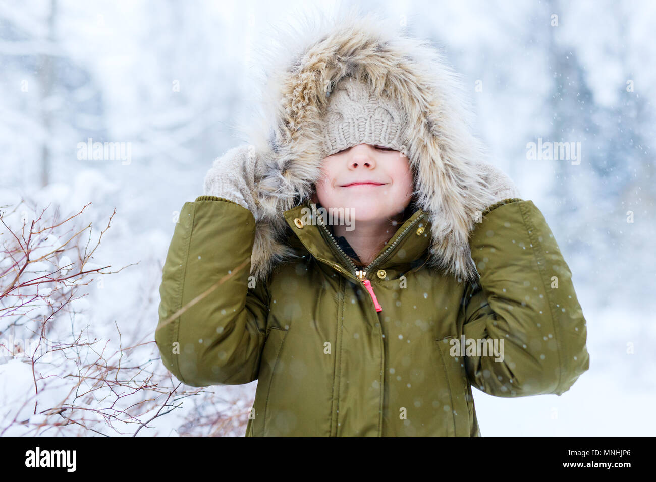 Adorable little girl outdoors on beautiful winter snow day Stock Photo ...
