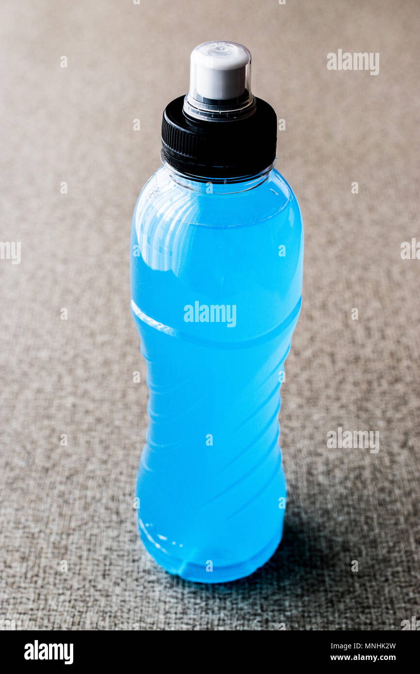 Blue Energy Drink on grey surface. Sport Concept Stock Photo - Alamy