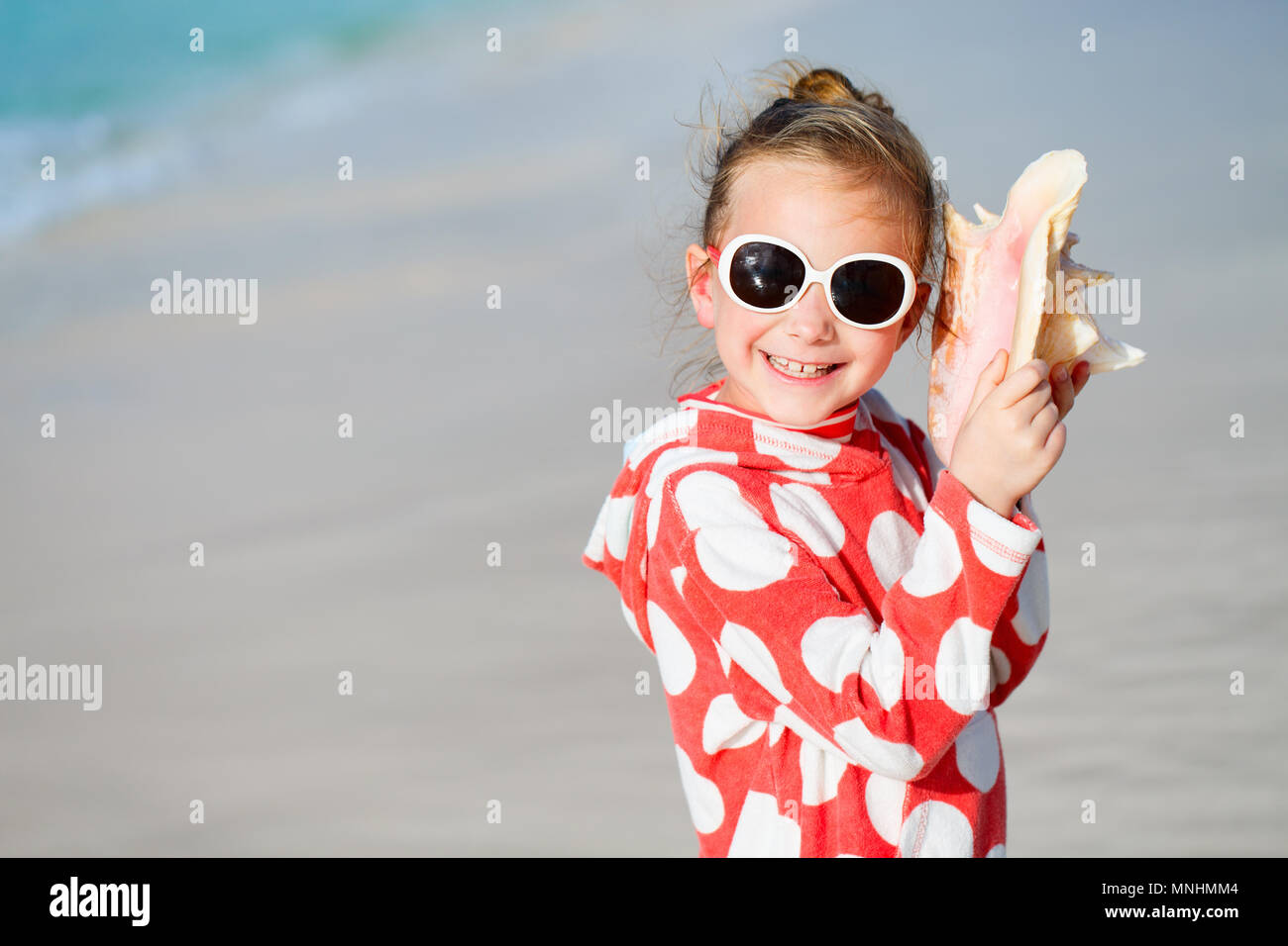 Little Girl With Seashell High Resolution Stock Photography and Images ...