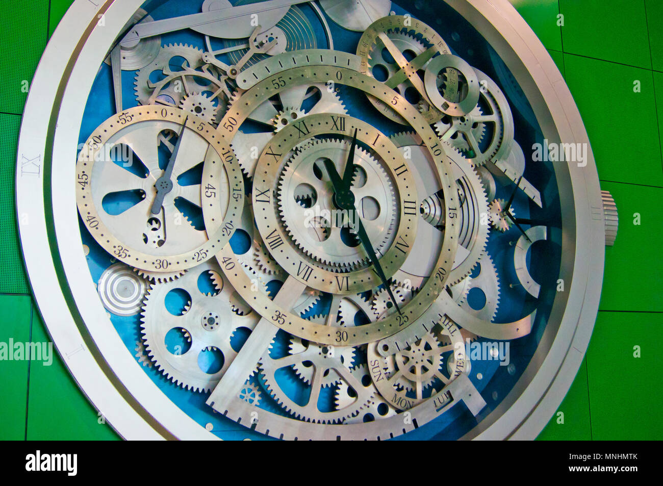 A oversized wall display of the hands, dials and internal workings of a ...