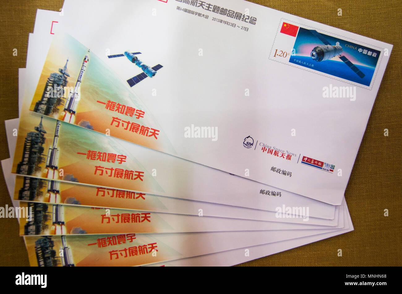 A set of postage stamp covers featuring a Chinese rocket launch and ...
