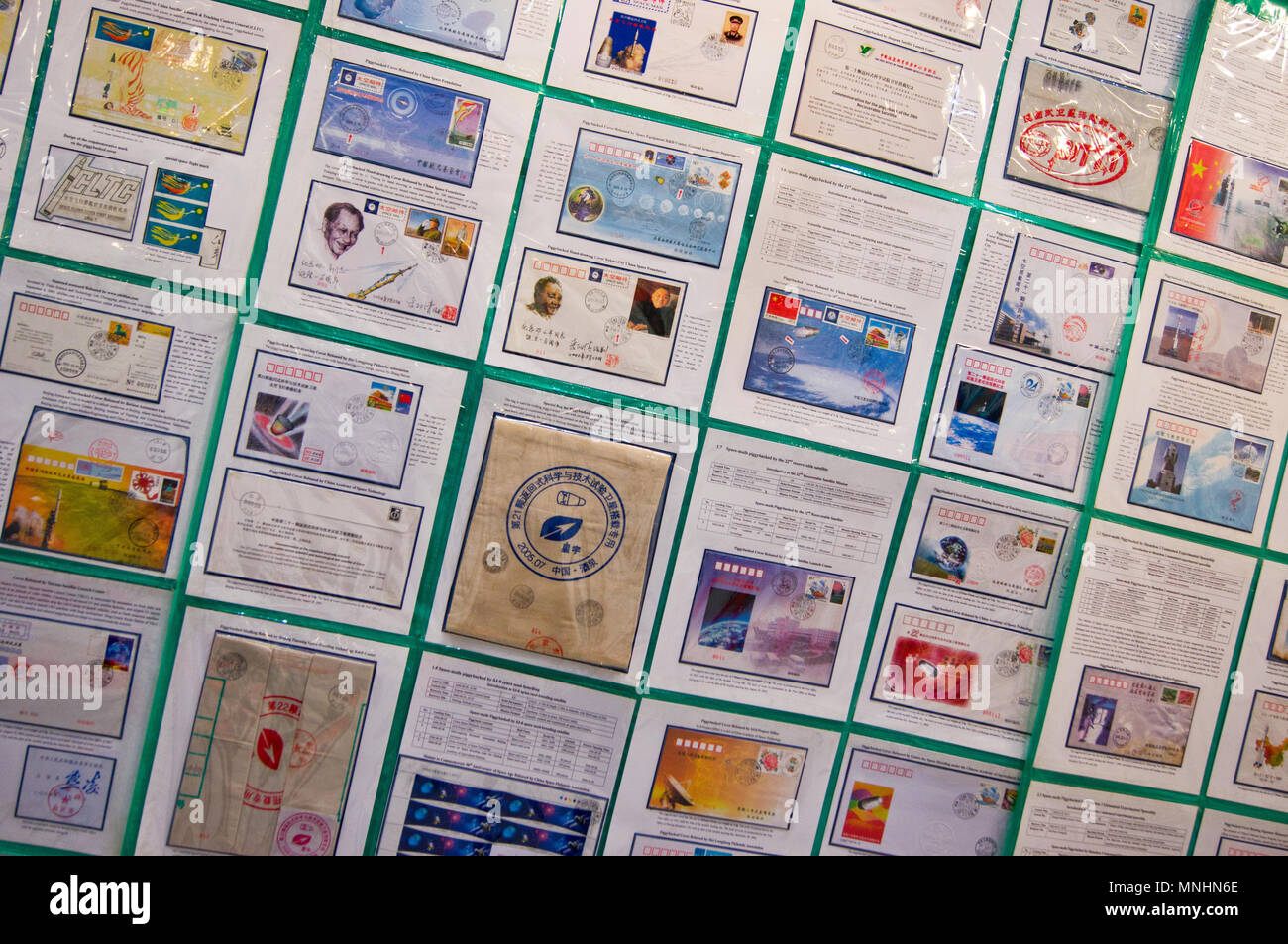 A display of postage stamp covers featuring Chinese rockets and ...