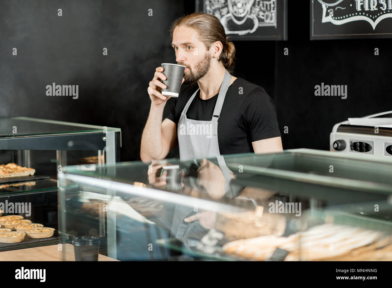Handsome barista in uniform hi-res stock photography and images - Alamy