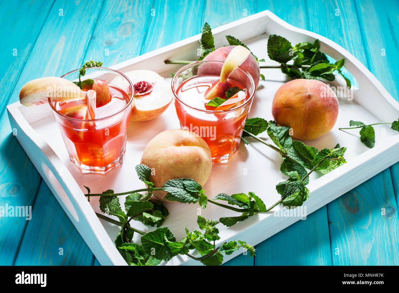 Homemade lemonade with ripe peaches and fresh mint Stock Photo - Alamy
