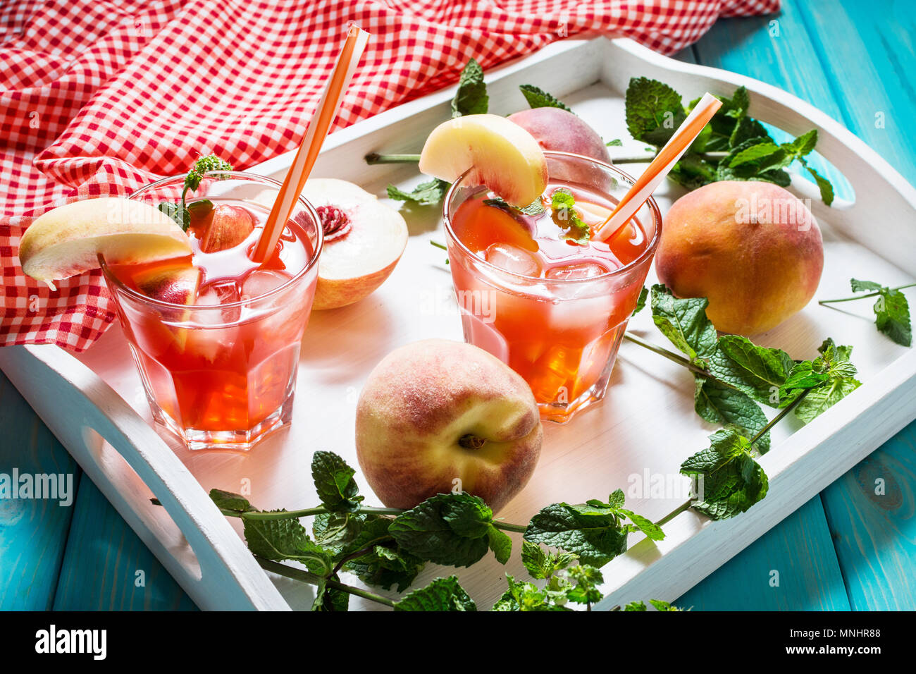 Homemade lemonade with ripe peaches and fresh mint Stock Photo - Alamy