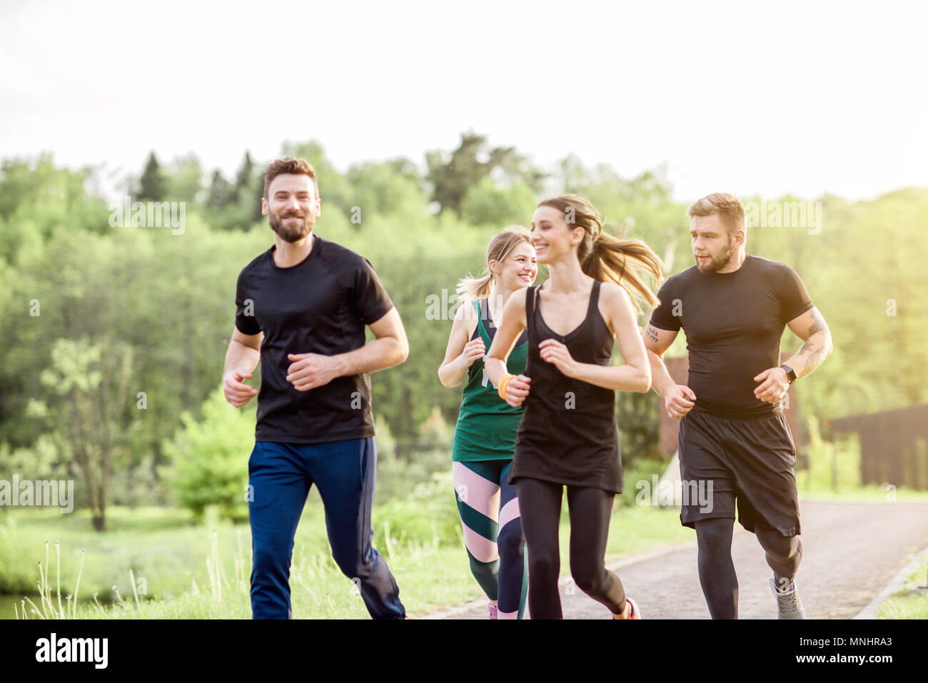 Group people jogging in park hi-res stock photography and images - Alamy