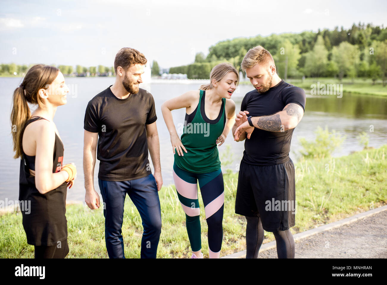 Sports team having fun standing together after the training outdors in ...