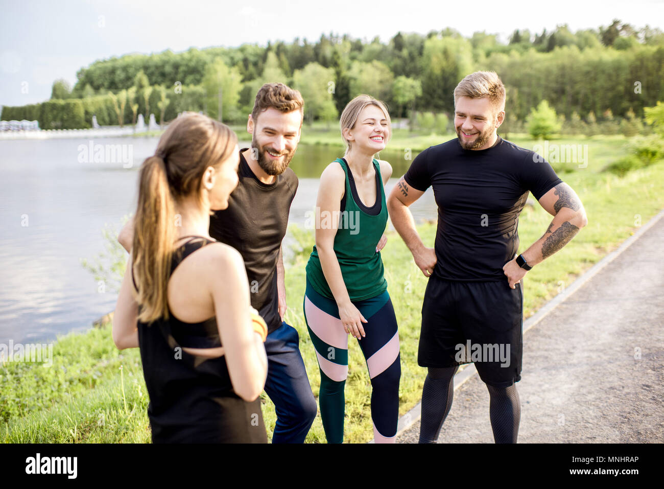 Sports team having fun standing together after the training outdors in ...