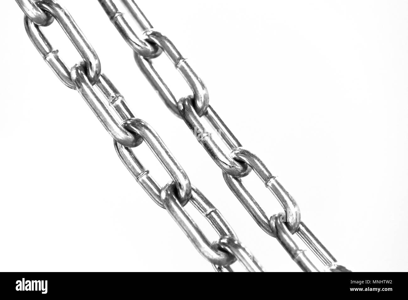 Abstract close up photo of metal chains isolated on white background ...
