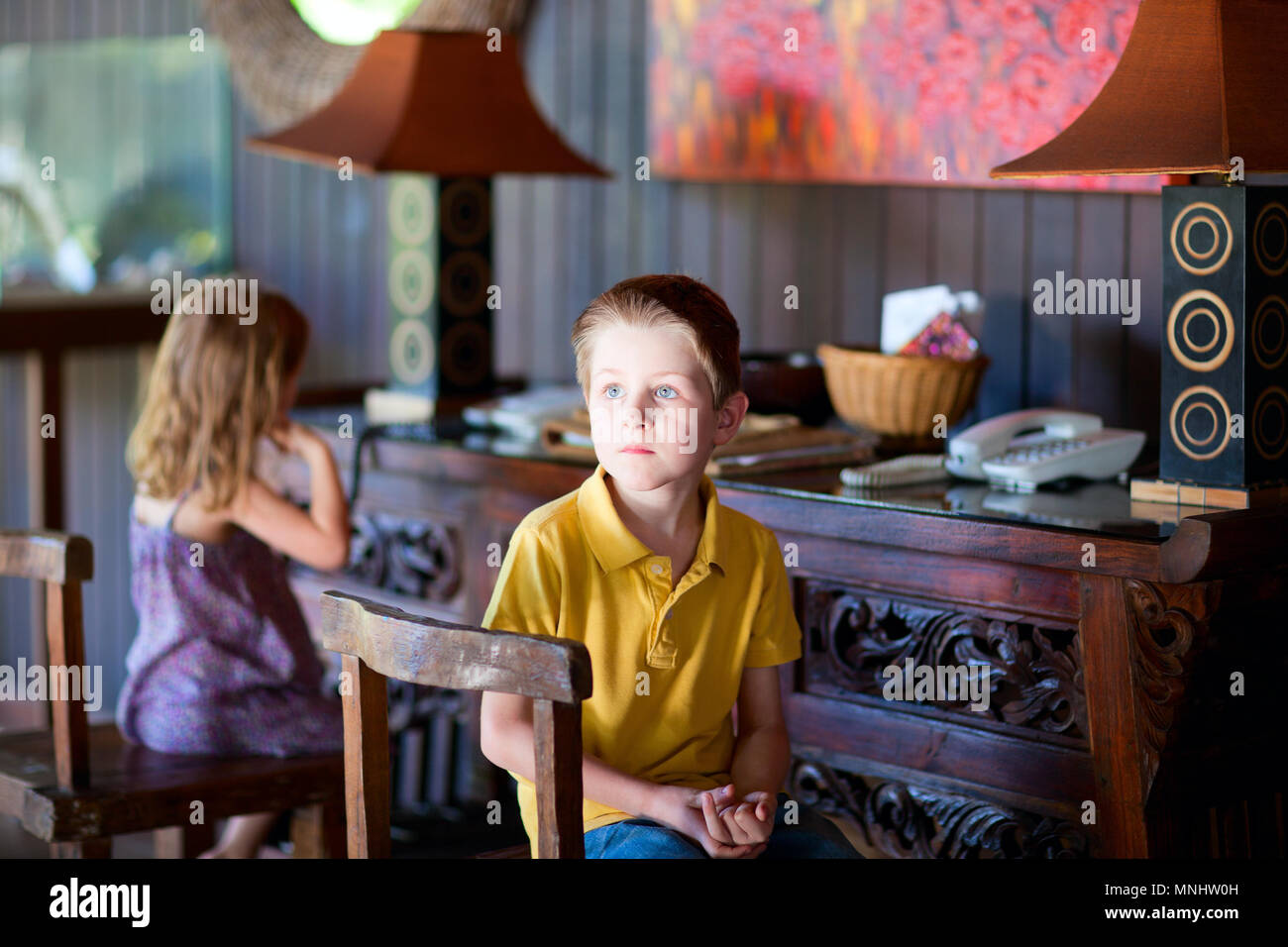 Portrait of two kids indoors in nicely decorated room Stock Photo - Alamy