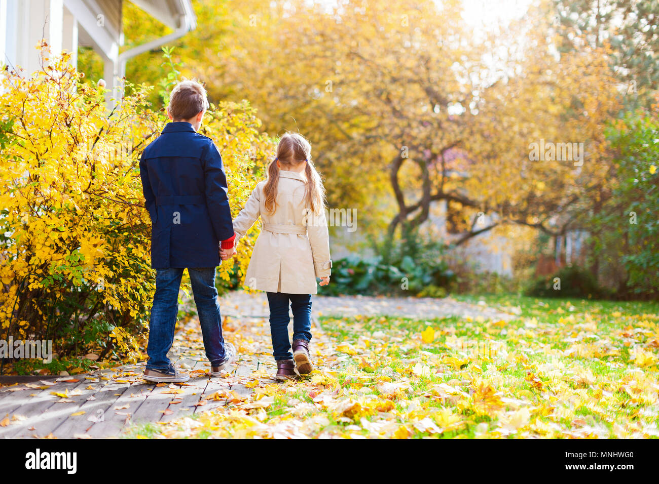 Two kids walking hi-res stock photography and images - Alamy