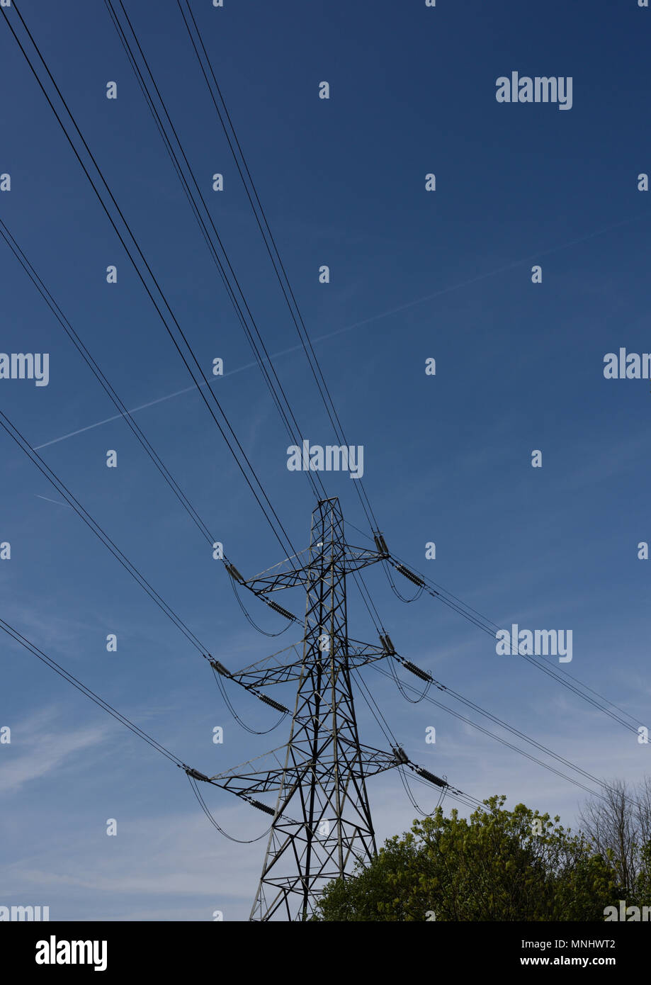 Electricity pylon and overhead high voltage power lines part of the the ...
