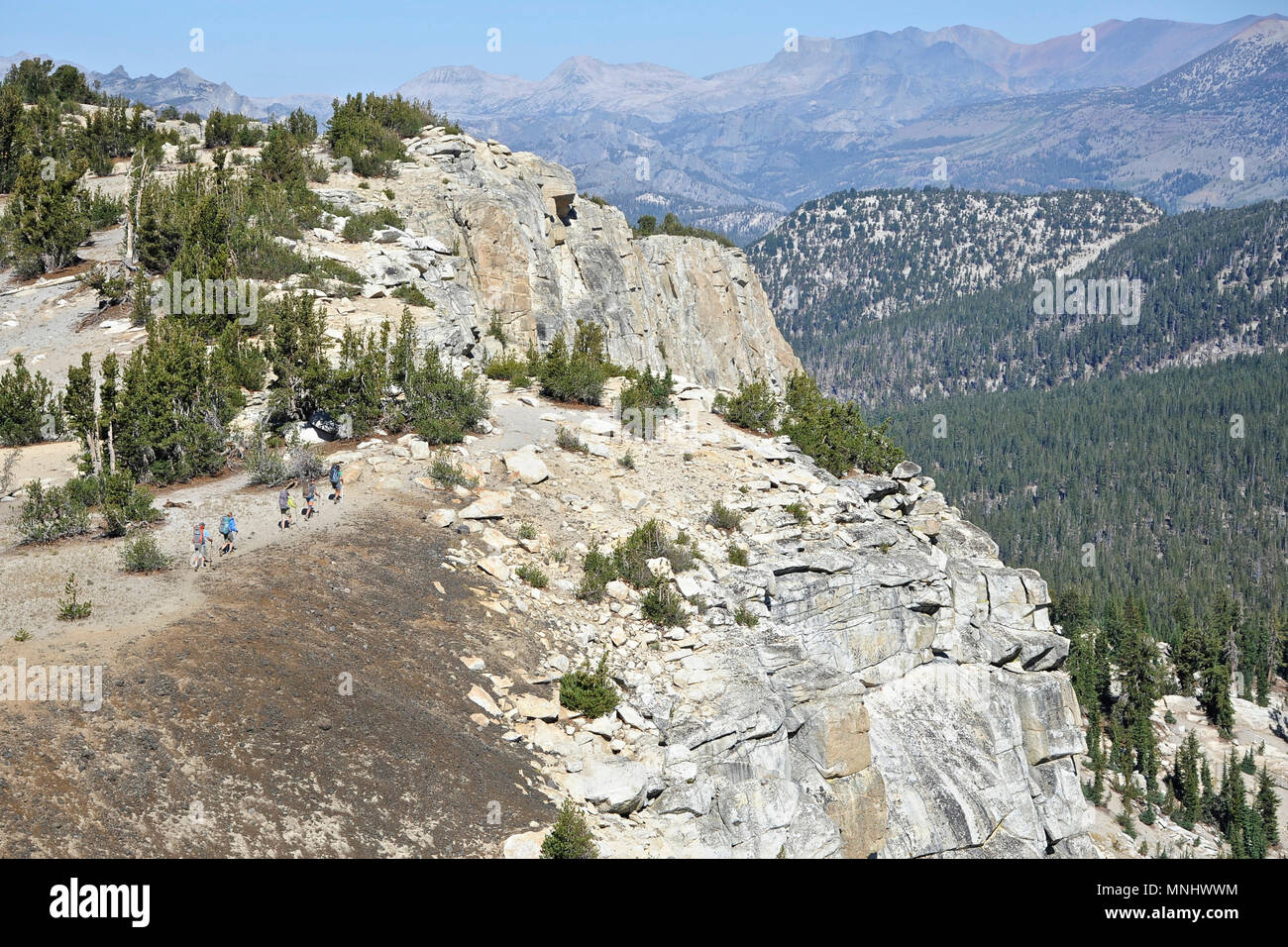 Backpackers hiking on Mammoth Crest to Mammoth Lakes on trek of Sierra ...