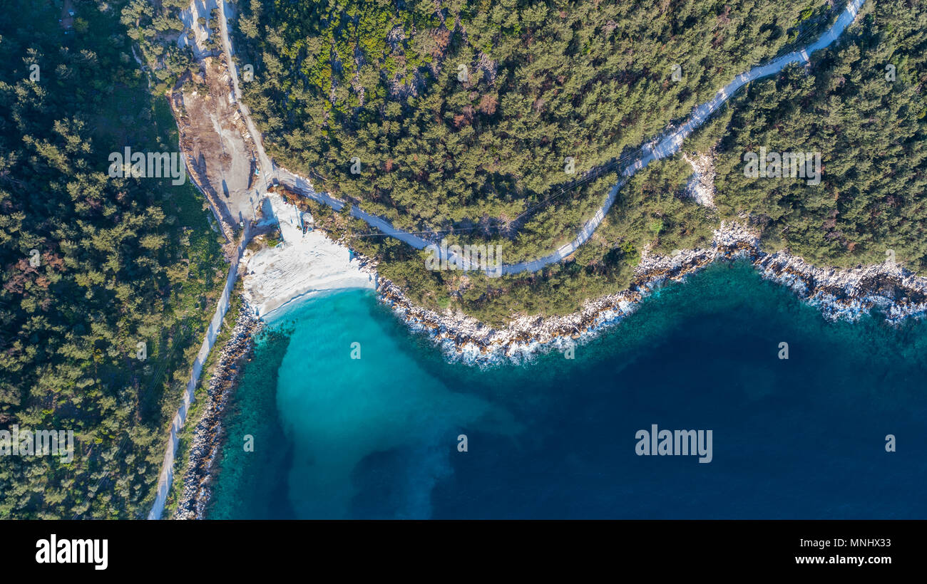 Aerial view of Marble beach. The most beautiful white beach in Greece ...