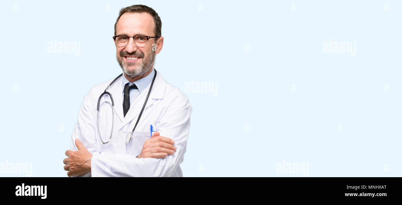 Doctor senior man, medical professional with crossed arms confident and ...