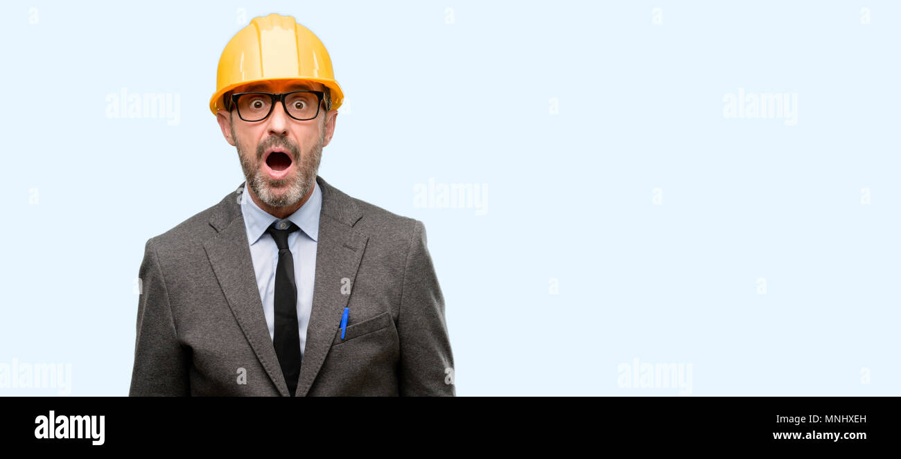 Senior architect or engineer scared in shock, expressing panic and fear ...