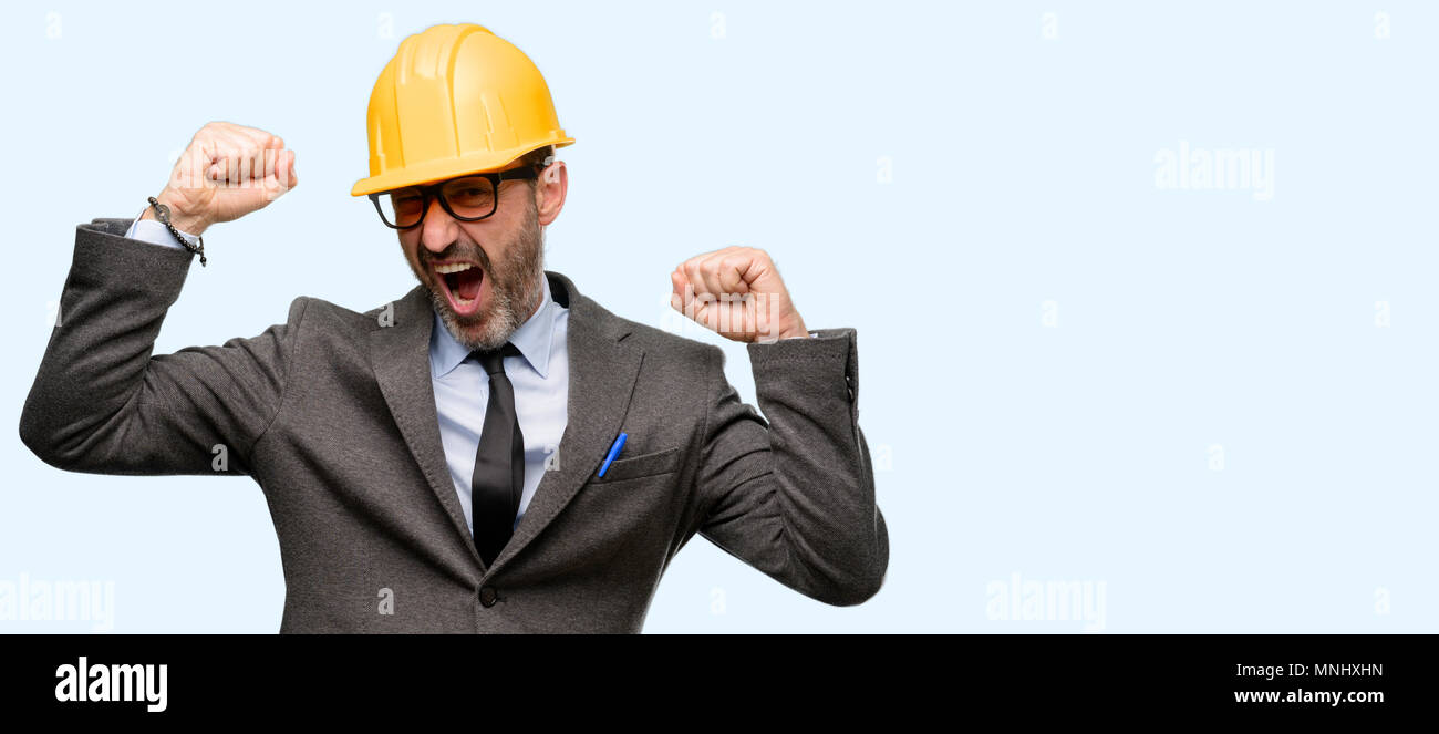 Senior architect or engineer happy and excited celebrating victory ...