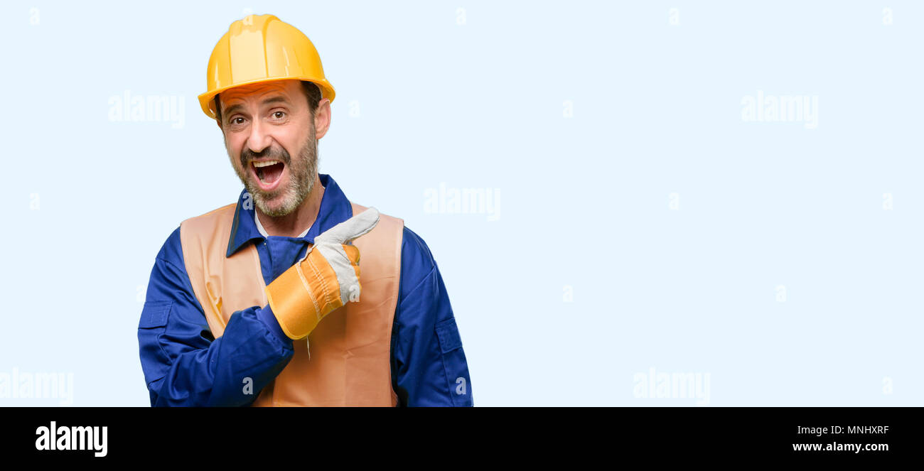 Senior engineer man, construction worker pointing away side with finger ...