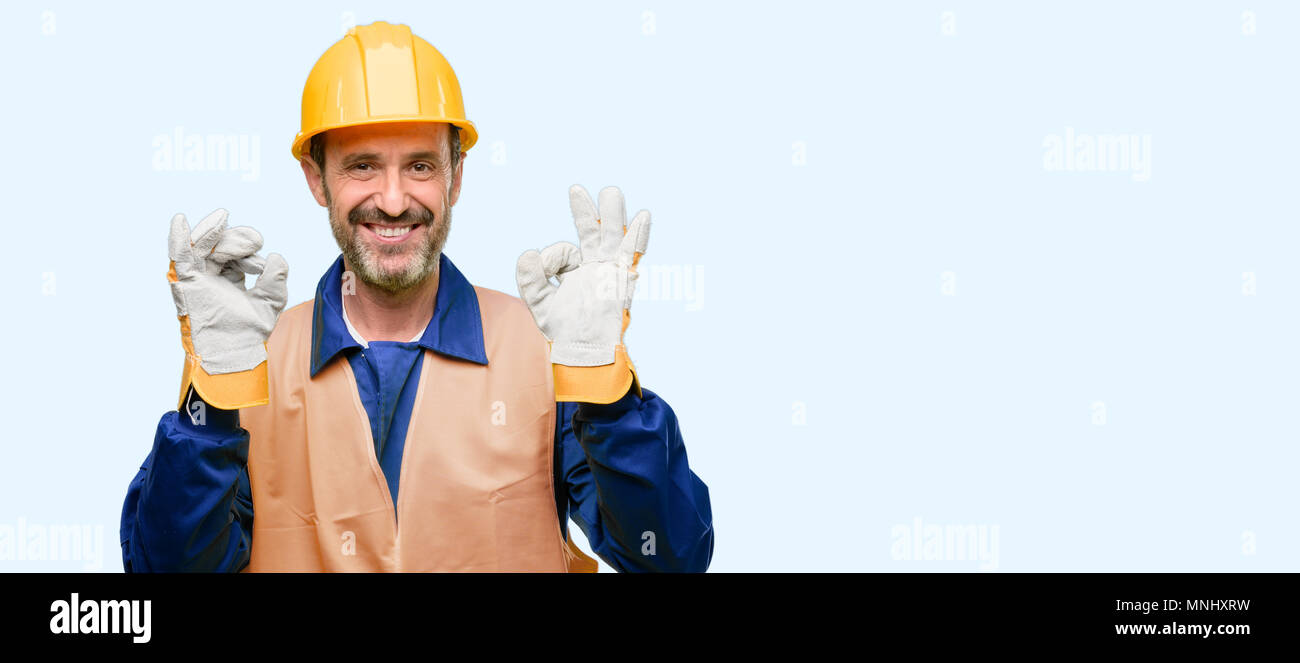 Senior engineer man, construction worker doing ok sign gesture with ...
