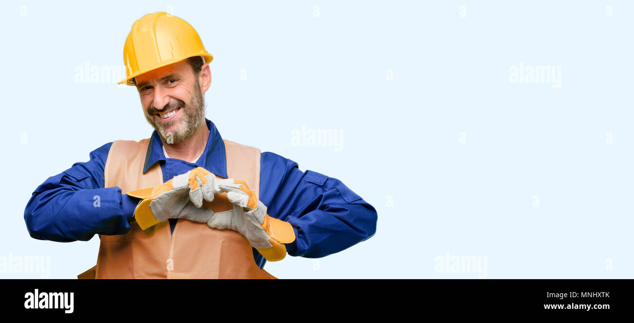 Senior engineer man, construction worker happy showing love with hands ...