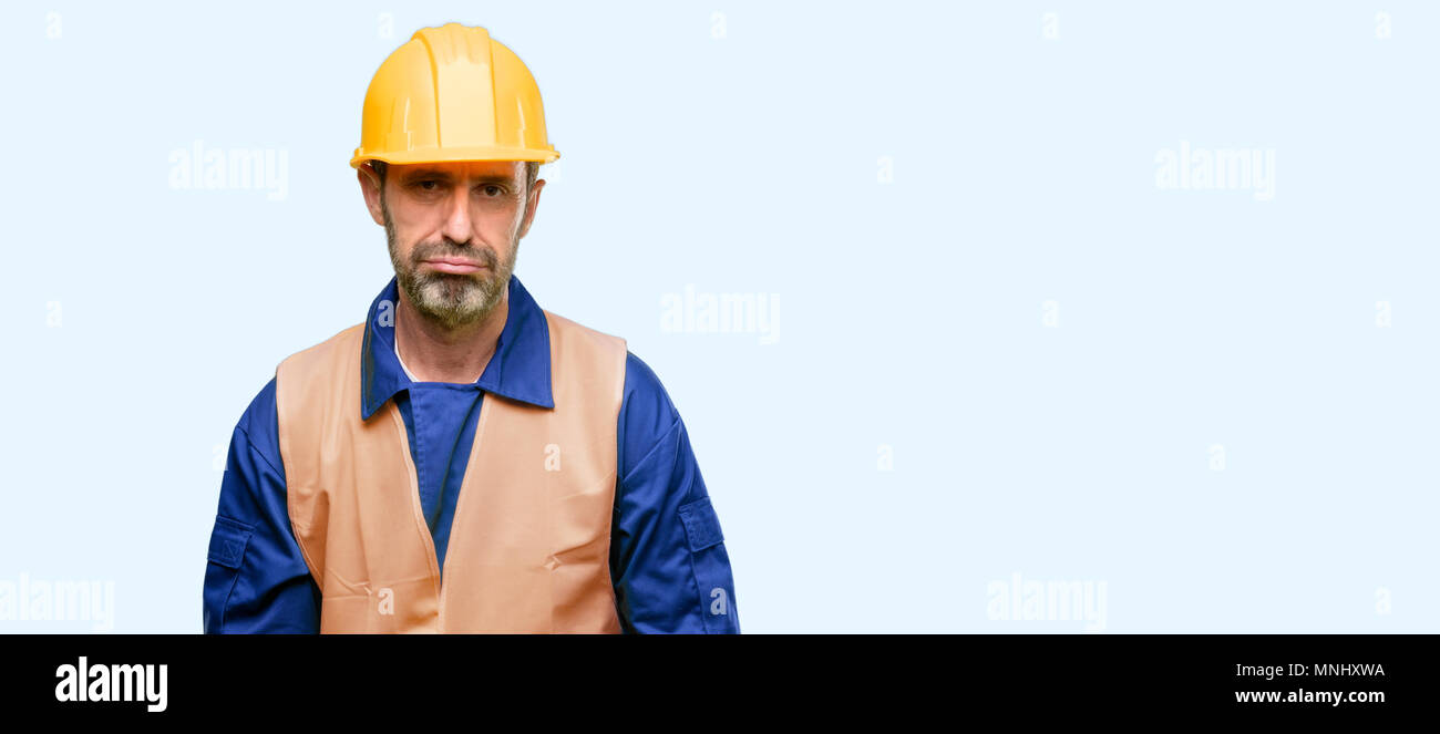 Rubbing head worker blue hi-res stock photography and images - Alamy